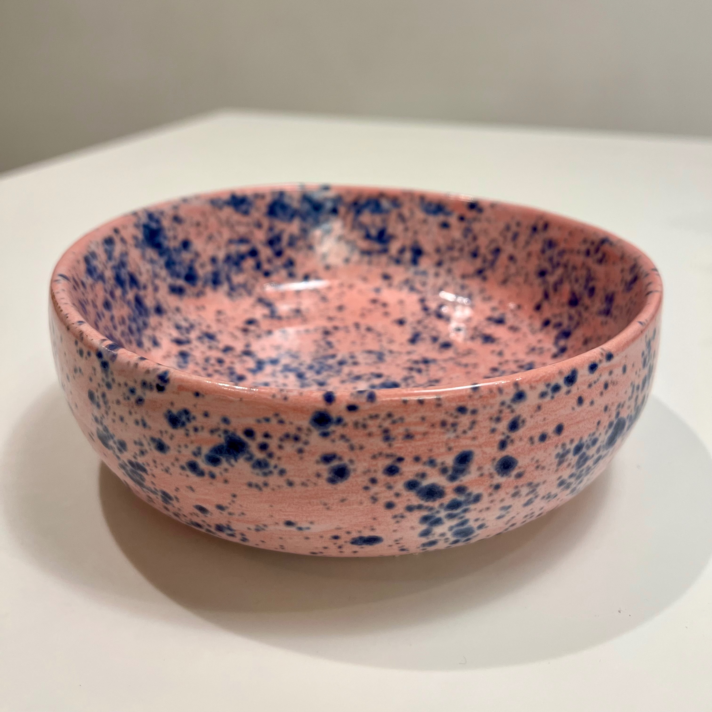 Mayco Blue splatterware over pink gloss | glazeshare
