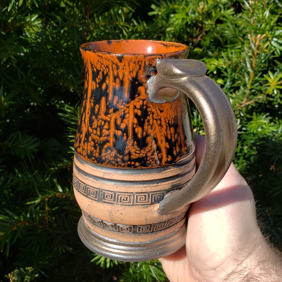 Deep sienna speckle and obsidian | glazeshare